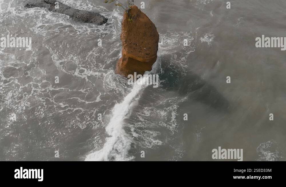 Slomo aerial birds eye over Buto Ni Kurakog islet, Bagamanoc ...