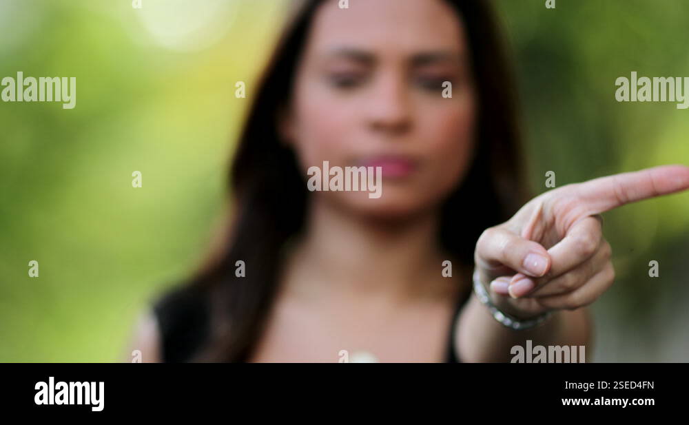 Woman in disapproval, hand STOP sign with finger, negative emotion ...