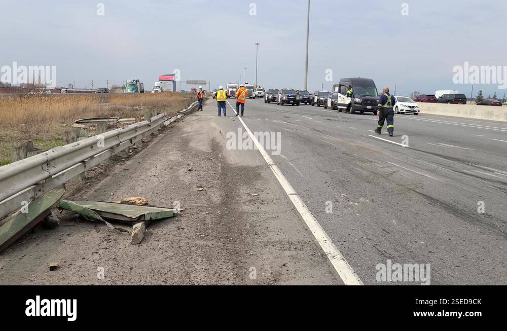 Car Crash on a highway in America - Pan shot of police and rescue ...