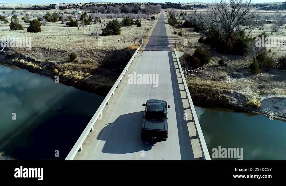 Truck Crossing over bridge that crosses over a river Stock Video ...