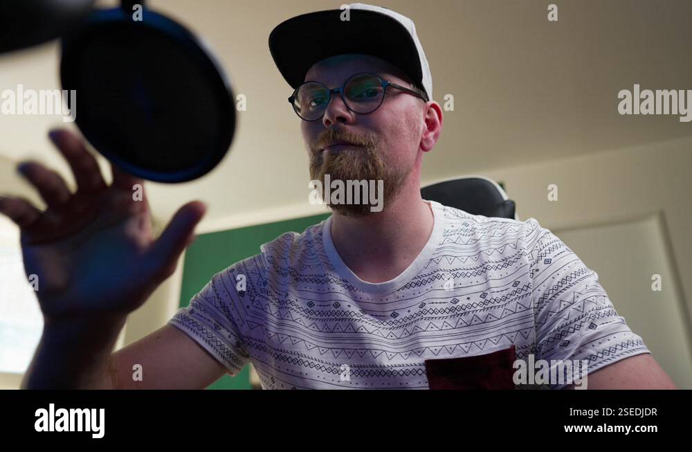 STREAMING - Man adjusts mic pop screen and talks, content creator ...