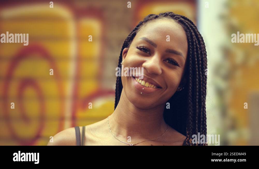 lightheartedness, youth - attractive hispanic woman smiles at the ...