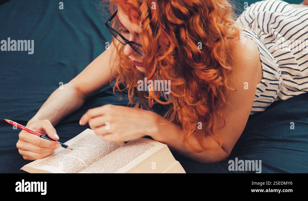 concentration, study - young woman lying on the bed studying for an exam Stock Video Footage - Alamy