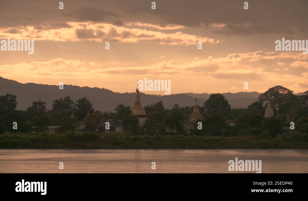 Dusk in Myanmar Countryside at the Irrawaddy River with Temple and ...