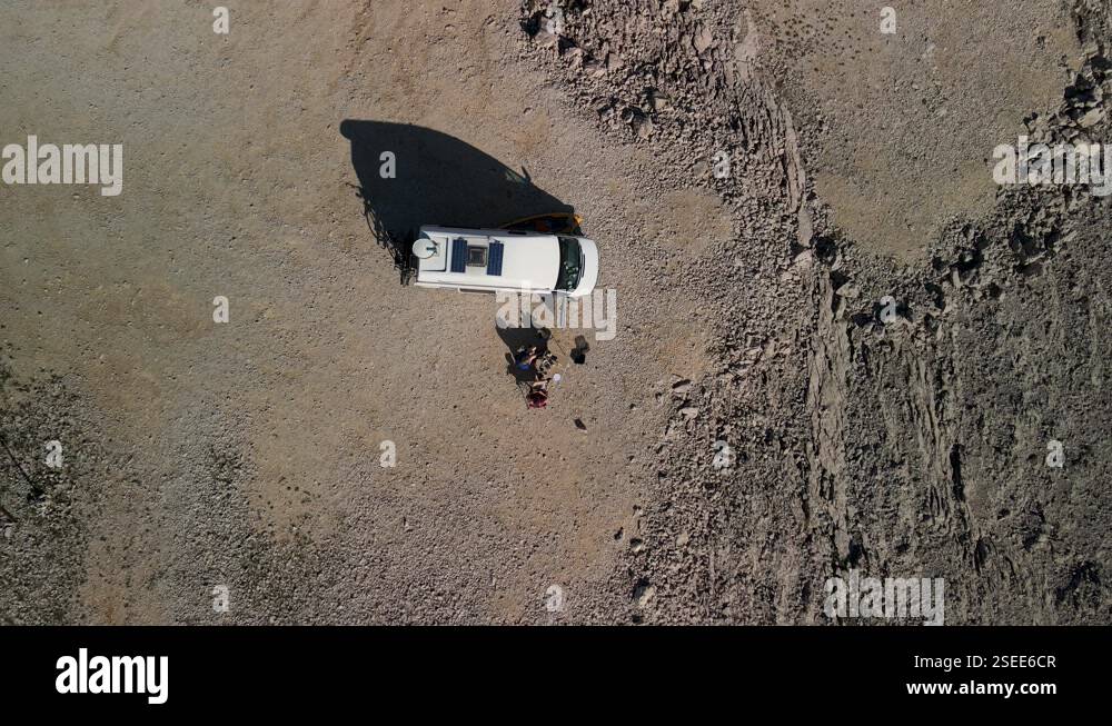 Couple on RV trip to life on mars trail, Island of Pag. Arid landscape ...