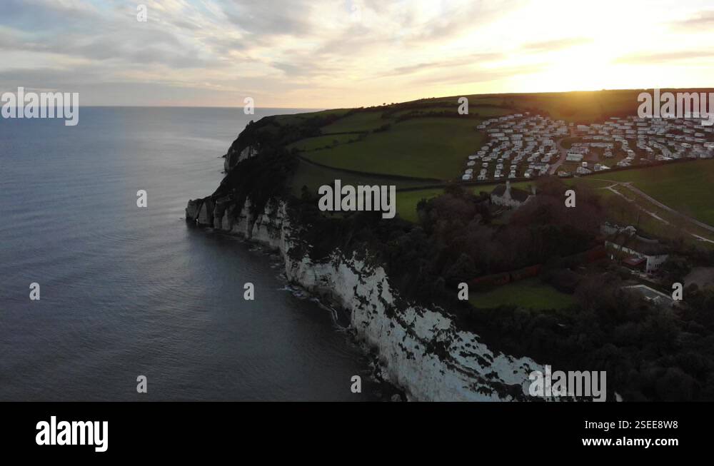 4K Slow Aerial shot above the sea and cliffs exposing the beautiful ...