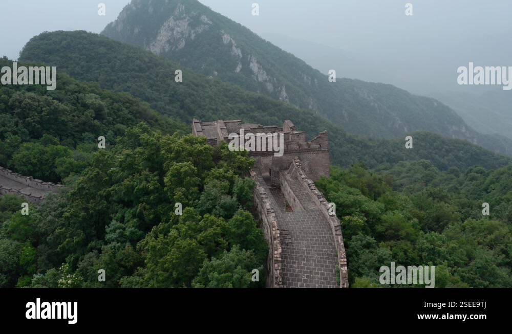 Fly over deteriorated lookout tower of Great Wall of China on top of ...