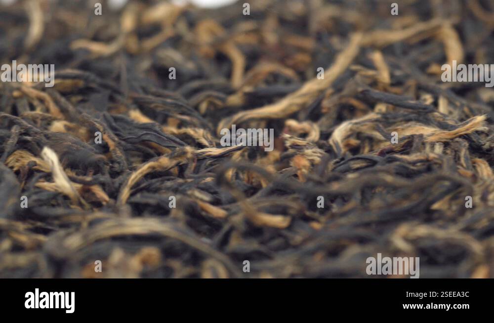 Heap of black tea on a white background. Dry black tea leaves ...