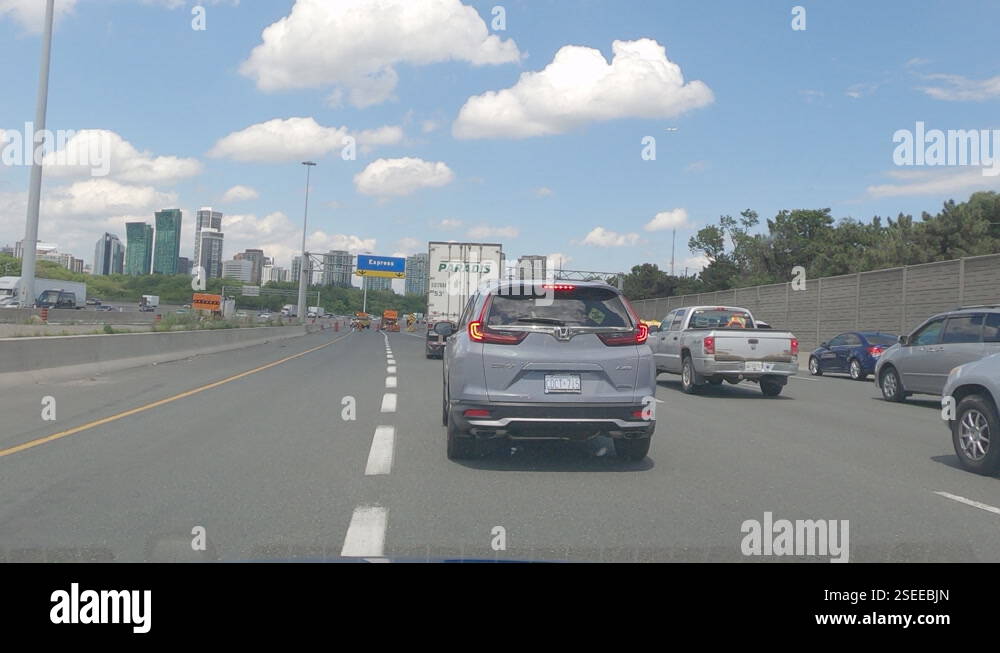 POV driving plate slow moving rush hour traffic gridlock on highway ...