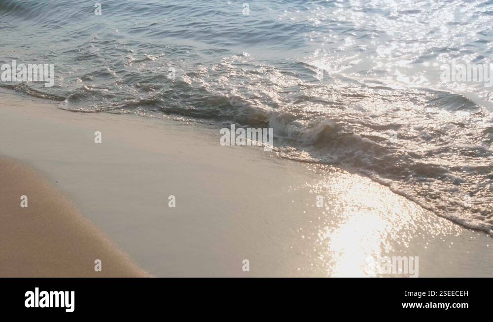 Sparkling wave over sand in slow motion Stock Video Footage - Alamy