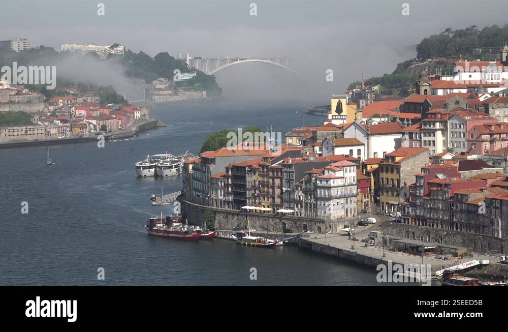 Beautiful view of central Porto with historic homes and bridge covered ...