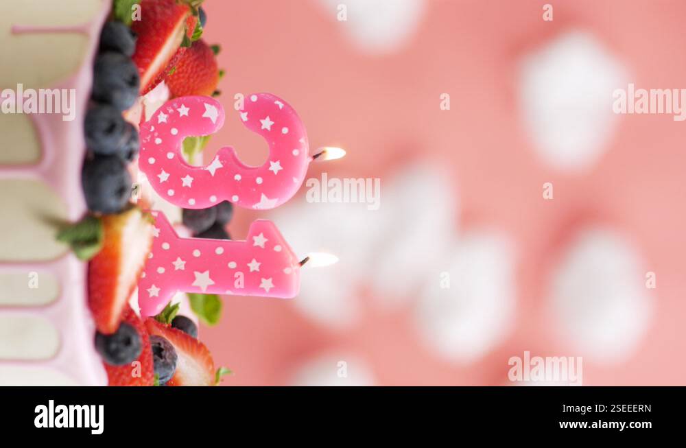 Birthday cake candle number 31. Vertical video of candle and cake on ...