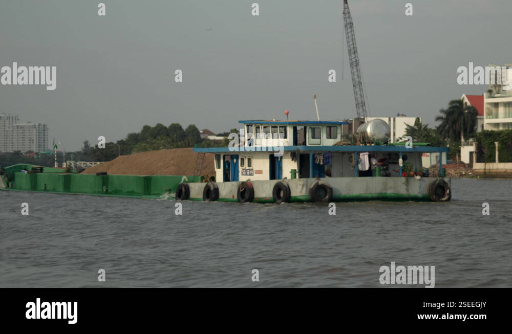 Cargo ship with sand load at Saigon river in Ho Chi Minh City, Vietnam ...
