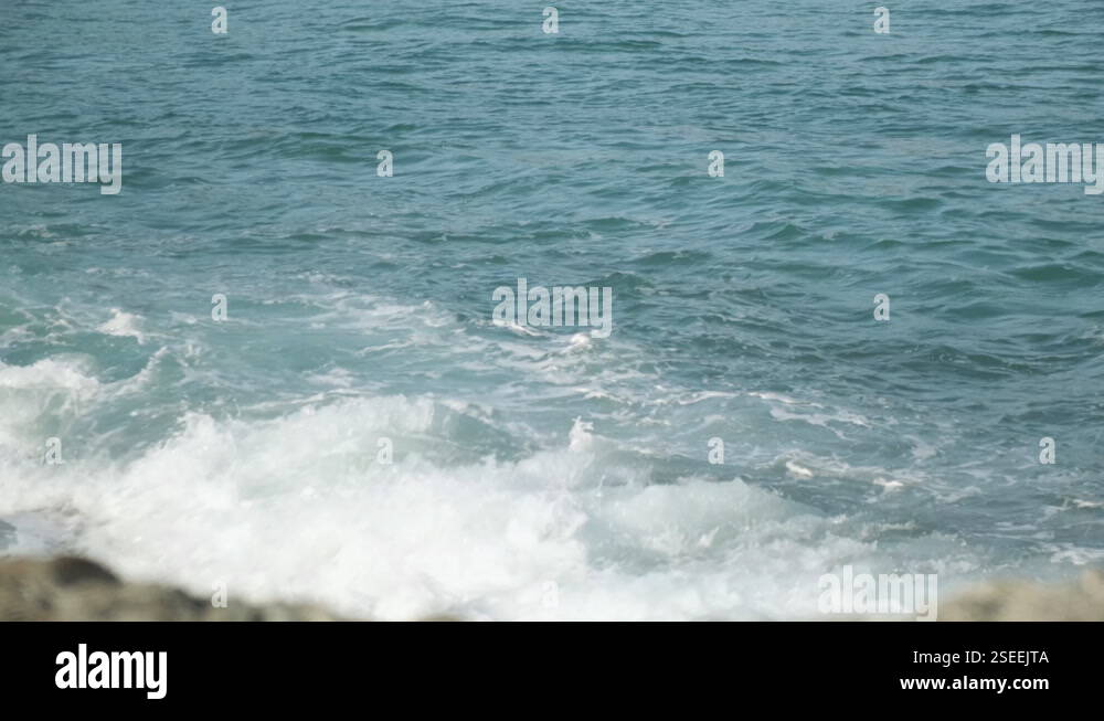 Choppy Sea Water. Small Waves. Tourism. Rocky Shore. Power of Water ...