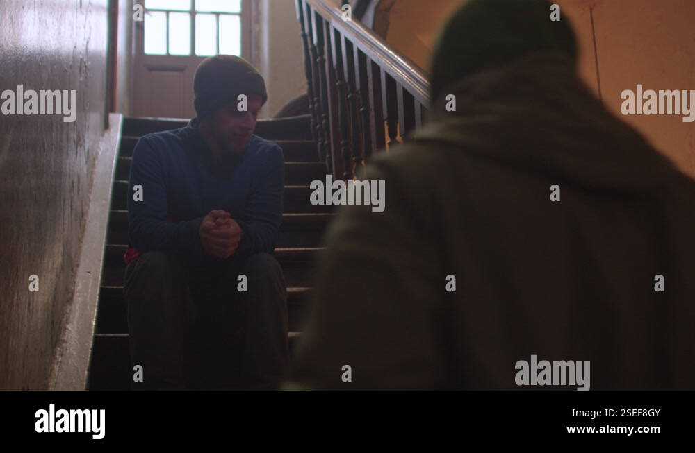 Two men meet stairs an old house. Communication neighbours an apartment ...