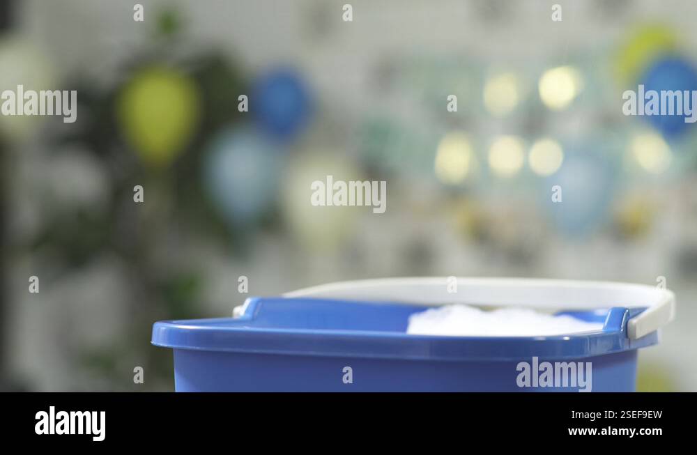 Red Mop dipping into a blue bucket of detergent spilling Stock Video ...