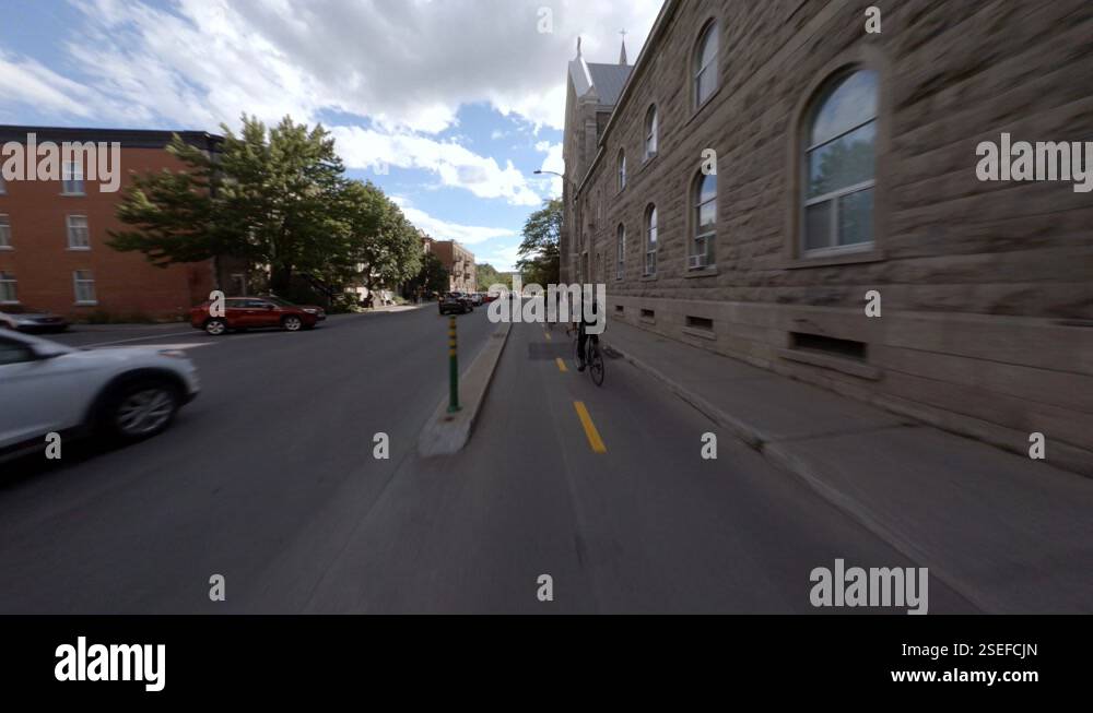 POV Cycling Along Tree Lined Rachel Street In Montreal Before Stopping ...