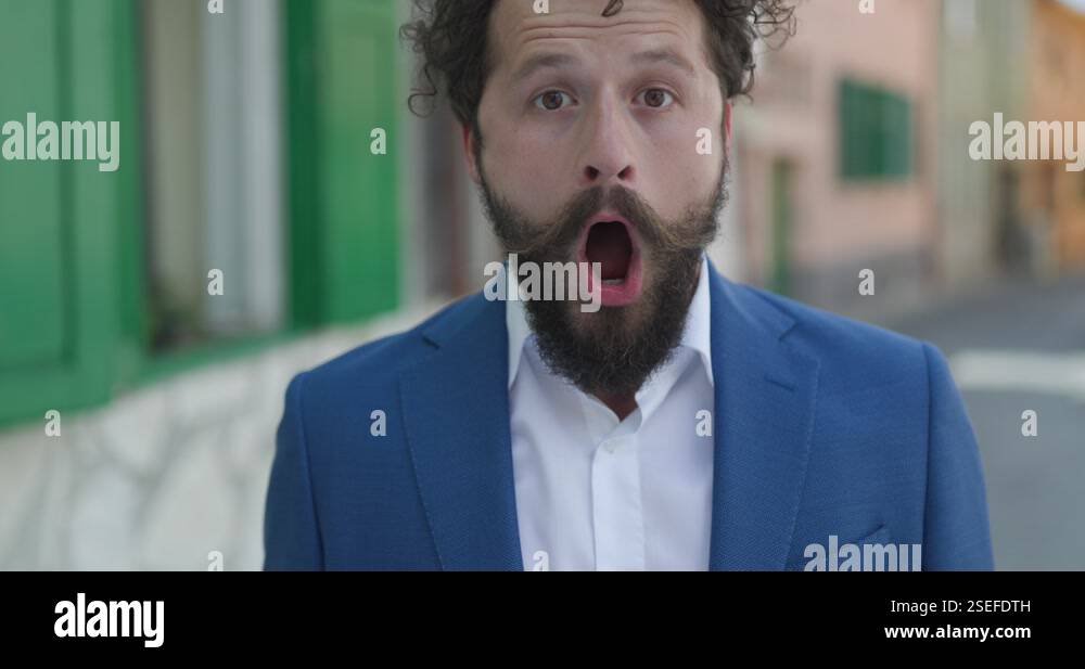 bearded shocked man opening mouth and getting scared, being surprised ...