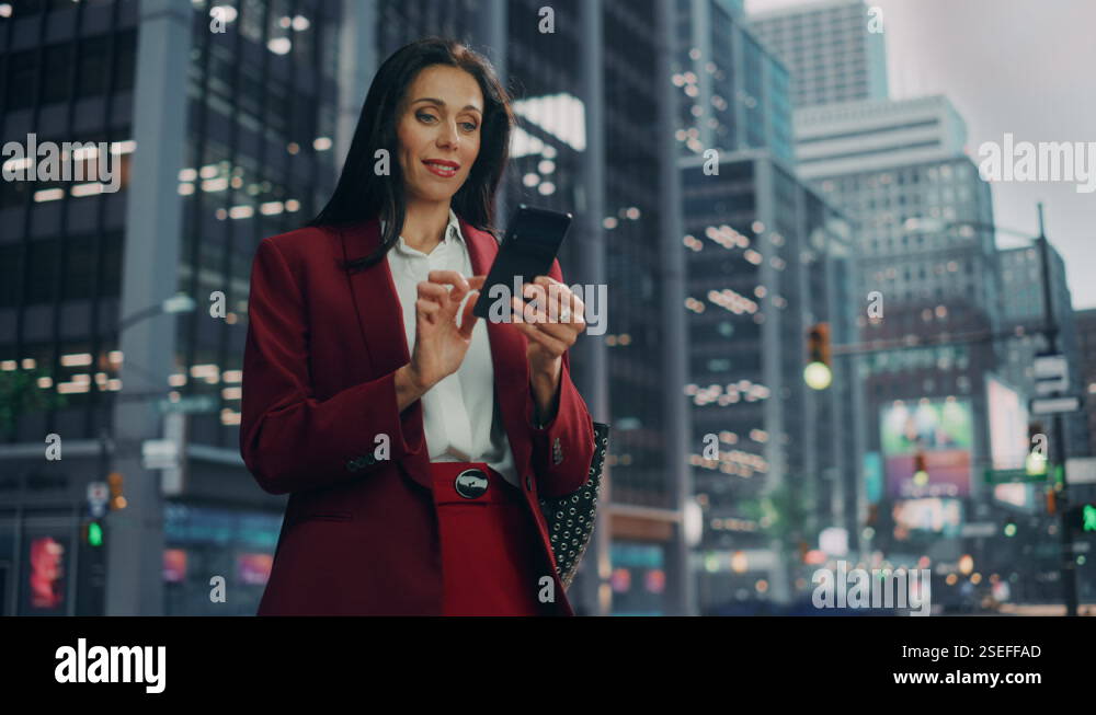 Female Uses Smartphone on City Street Stock Video Footage - Alamy