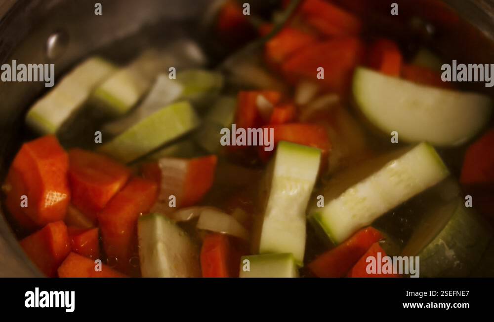 I put vegetables to boil. I prepare cream soup. 4k cinematography video ...