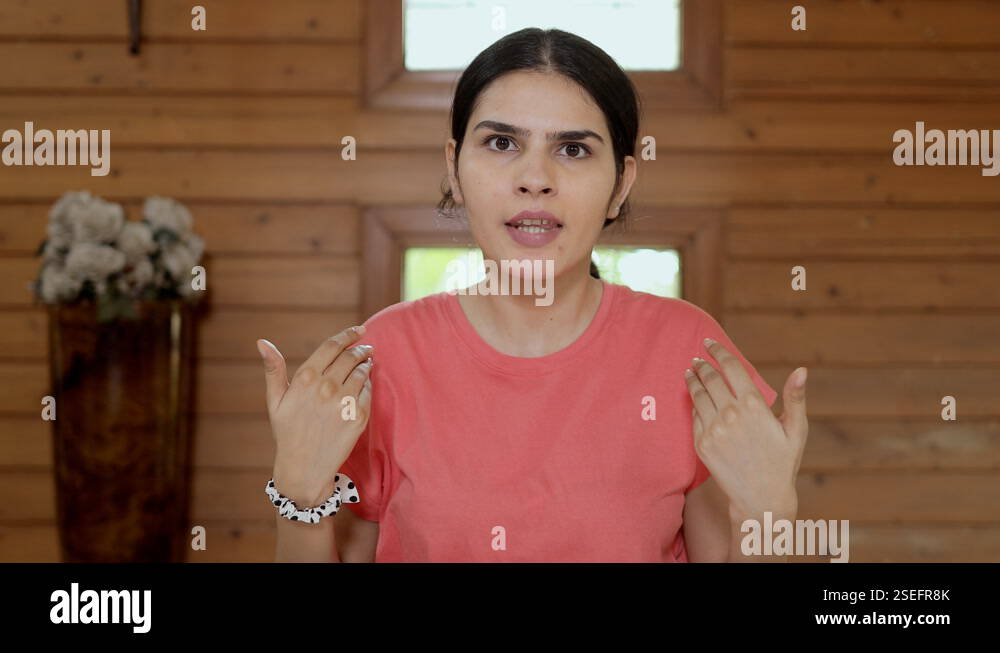 Frustrated Indian girl yelling and insulting someone while looking at ...