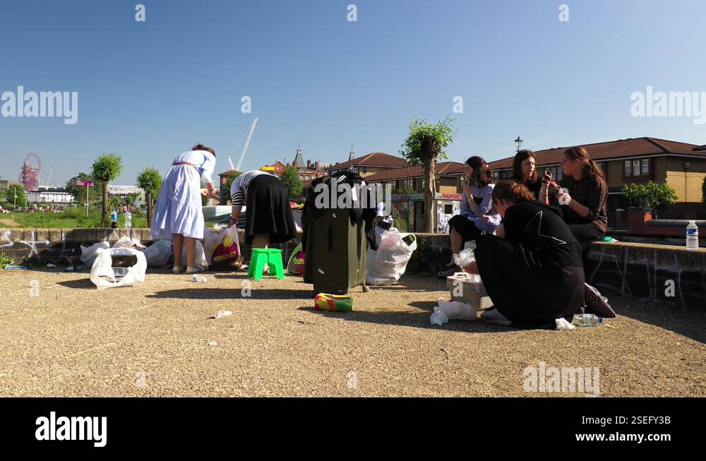 women sorting and cleaning up litter in public areas Stock Video ...