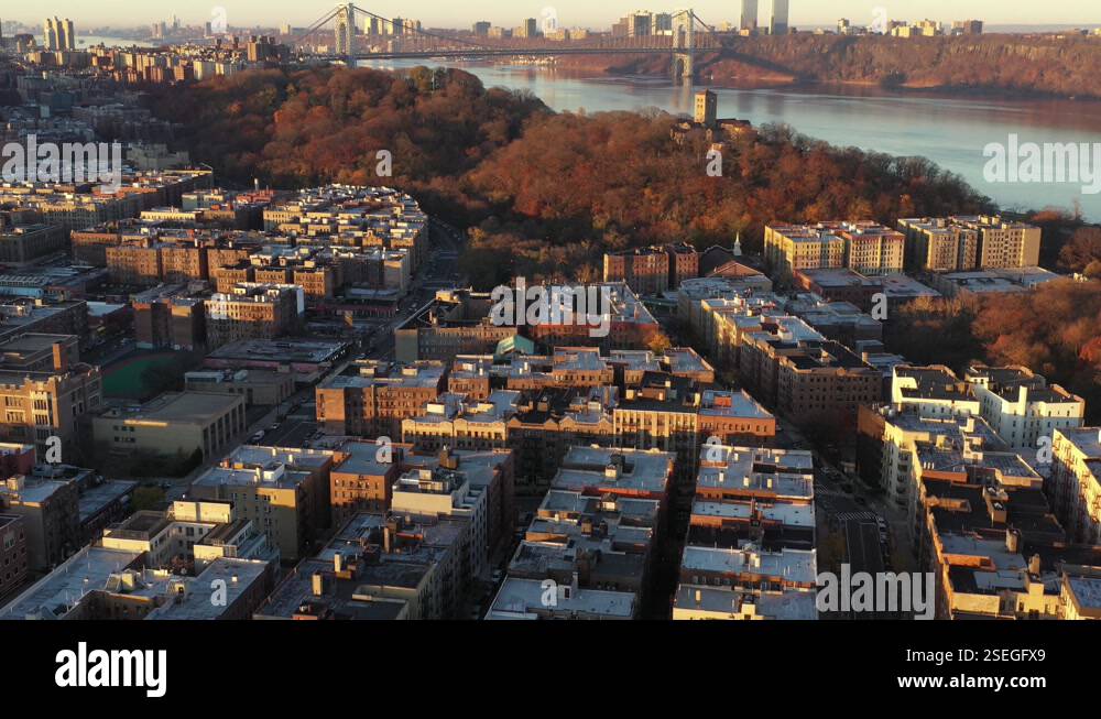 Epic golden hour aerial tilt up to reveal the George Washington Bridge ...
