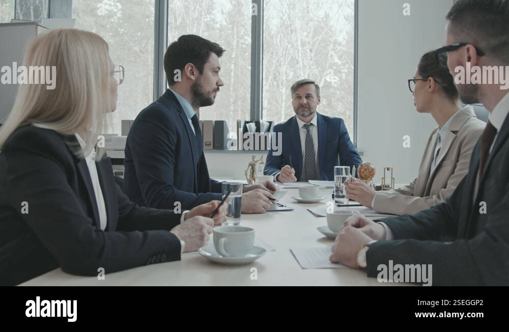 Team of Attorneys at Conference Table Stock Video Footage - Alamy