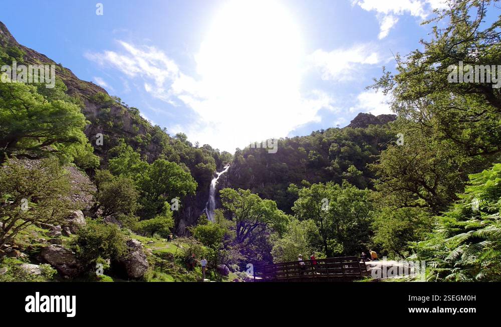 People trekking at Aber falls Snowdonia mountain Welsh national park ...
