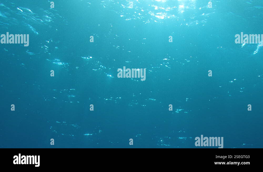 Sun penetrating ocean surface. Underwater god rays vfx background ...