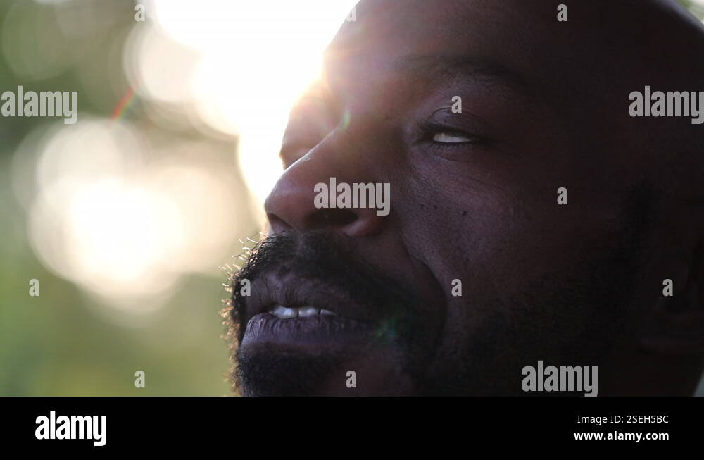 Person opening and closing eyes in meditation and contemplation, close ...