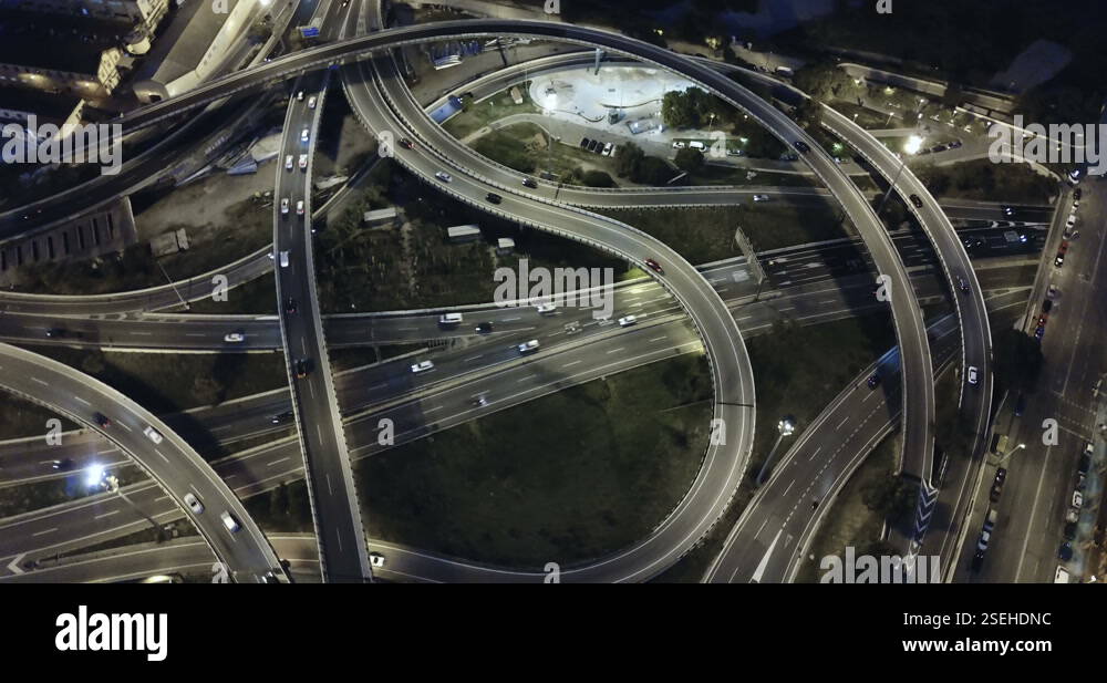 Aerial view of lighted highway road junctions at night Stock Video ...