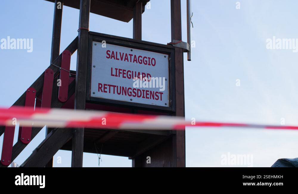 A lifeguard tower at a beach in Italy with text in Italian, English and ...