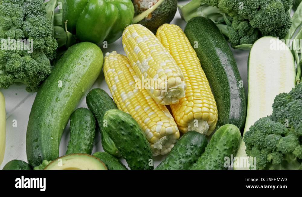 A tabletop arrangement of a variety of fresh fruits and vegetables ...