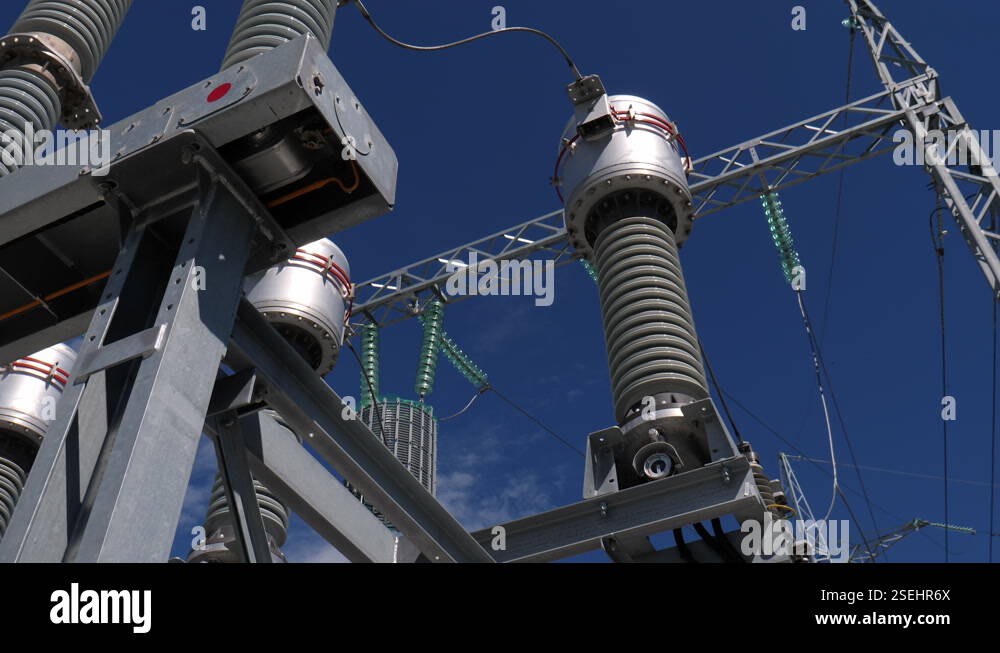 Insulators with cables on supports at electricity substation Stock ...
