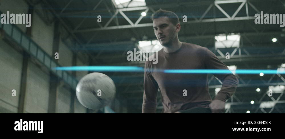 Football Player Juggling Ball on Indoor Field Stock Video Footage - Alamy