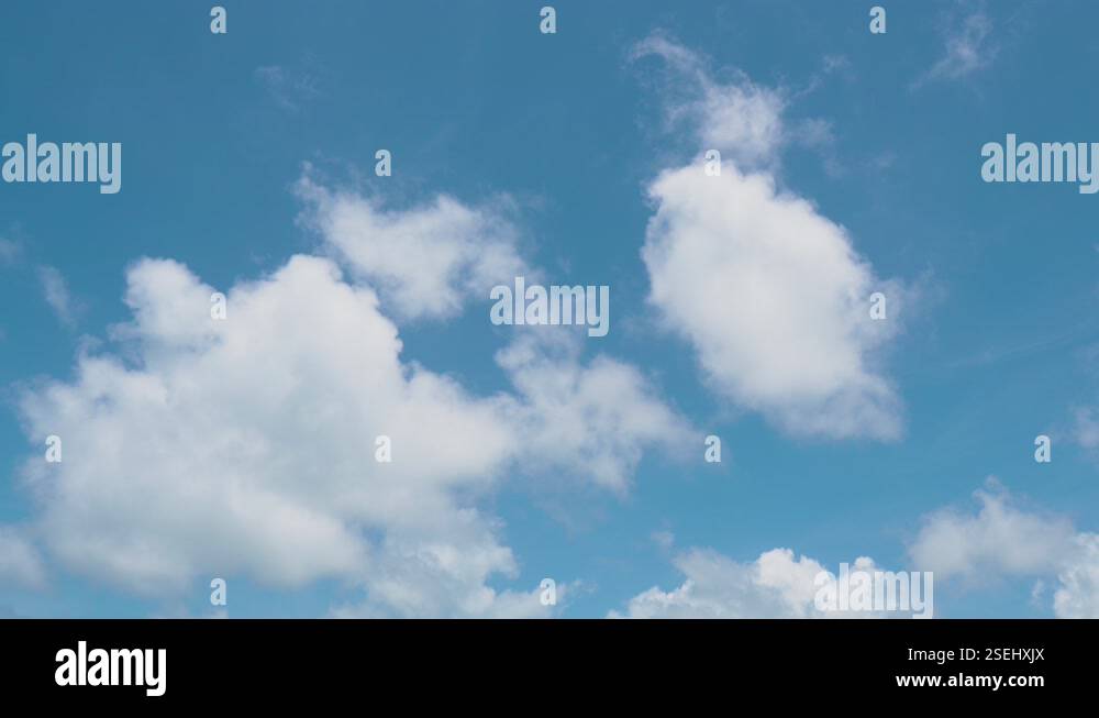 The bright azure sky and beautiful white clouds scattering to the sides ...