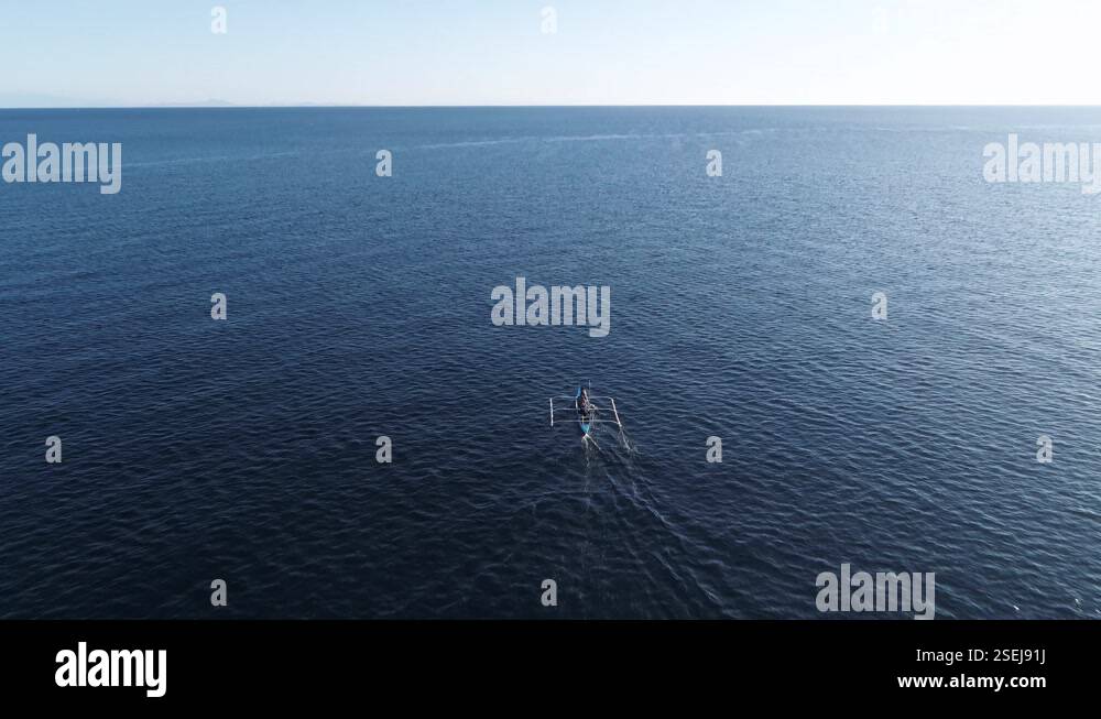 Traditional Bangka boat in blue ocean water, voyage of fisherman in ...
