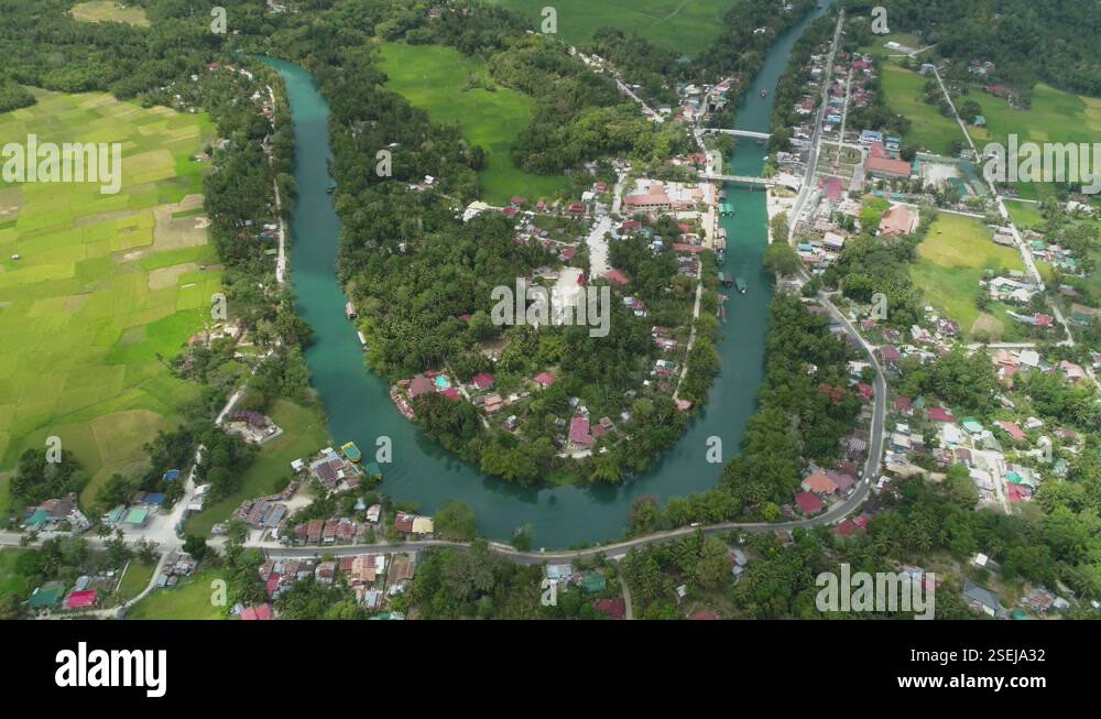 Loboc river on tropical island Bohol with surrounding rural town on ...
