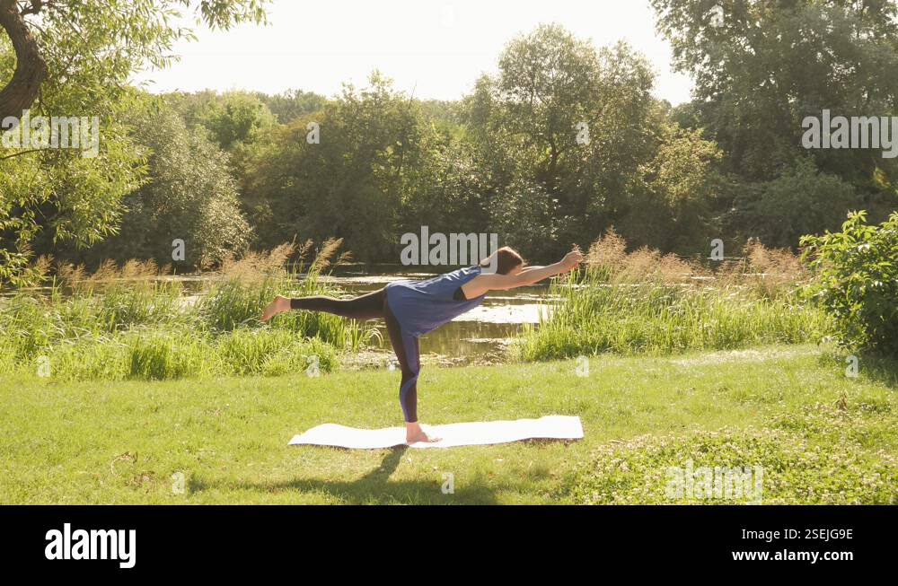 New normal sport outdoor. Young sport woman stretching her body in park ...