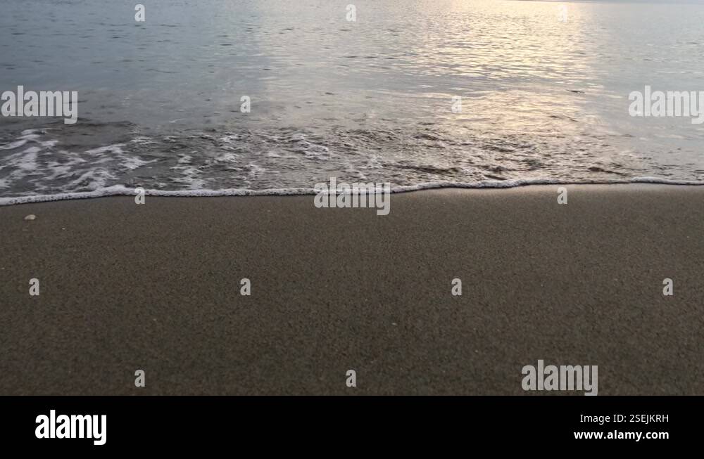 Seashore ( Sunrise small waves Stock Video Footage - Alamy