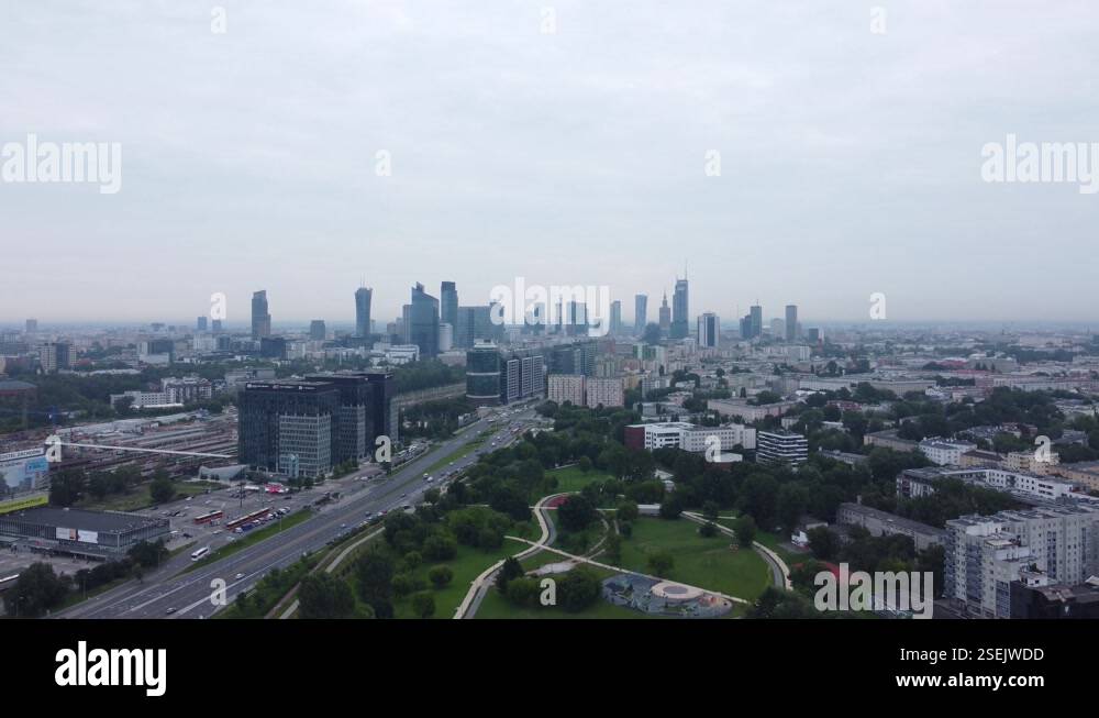A drone video of city road near a park in Warsaw, Poland Stock Video ...