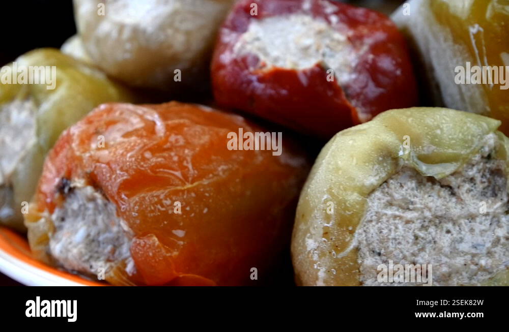 Frozen semi-finished products, stuffed bell peppers rotate on counter ...
