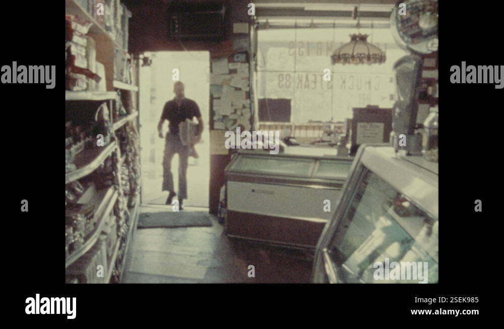 1970s: Man enters grocery store, turns on lights, opens cash register ...