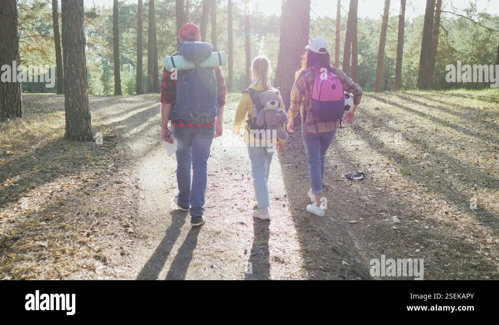 Family on hike. Happy family open map planning a hiking adventure ...