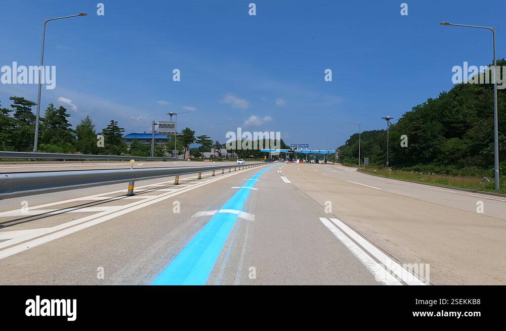 Driving Motorist On The Expressway Approaching Hajodae Toll Gate With ...