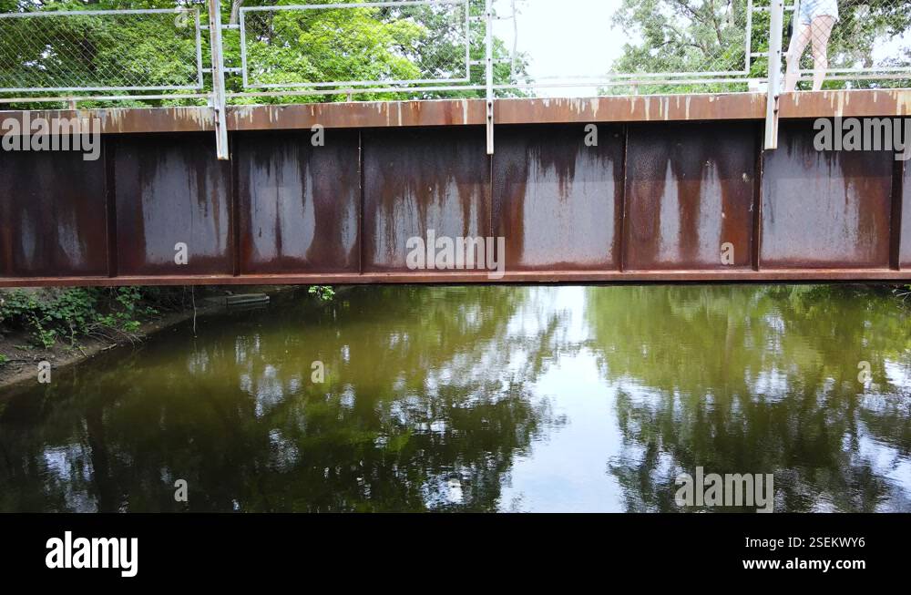 Metal bridge over an older river in Michigan Stock Video Footage - Alamy