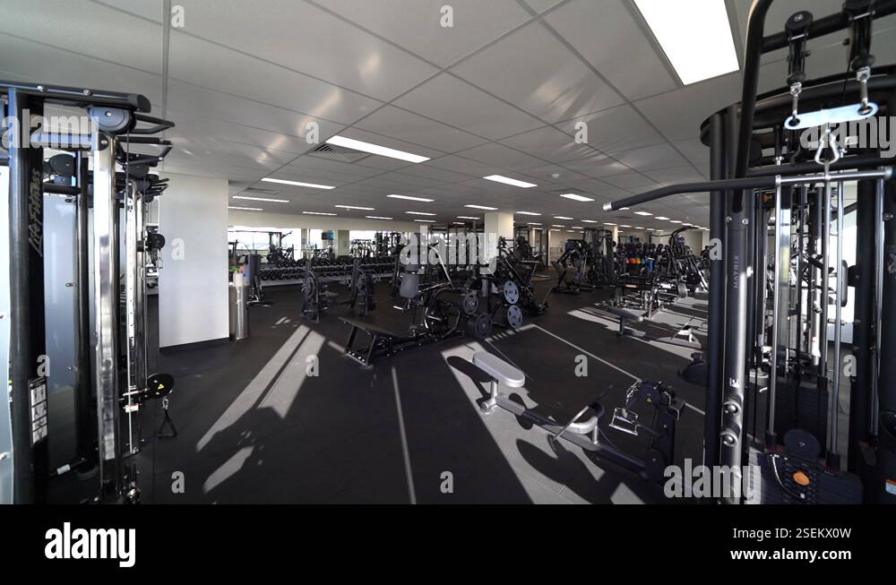 Spacious modern gym interior with many equipments, dolly forward Stock ...