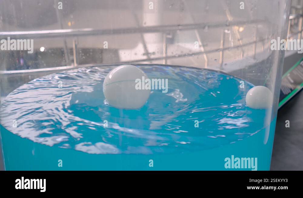 Plastic balls in vortex water generator at science museum - close up ...