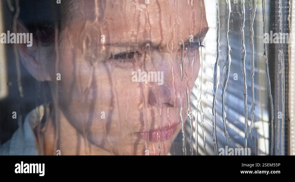 Sitting by raining window Stock Video Footage - Alamy